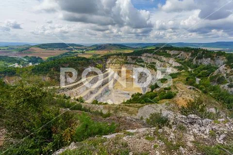 A surface limestone mine with terraced stairs for material removal in ...