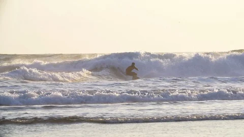 Surfer falls off surfboard and bails int... | Stock Video | Pond5