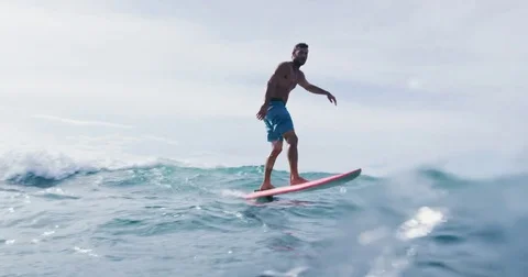 Surfer on hydrofoil surfboard riding blu... | Stock Video | Pond5