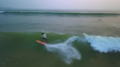 Surfer rides blue ocean wave and fall at... | Stock Video | Pond5