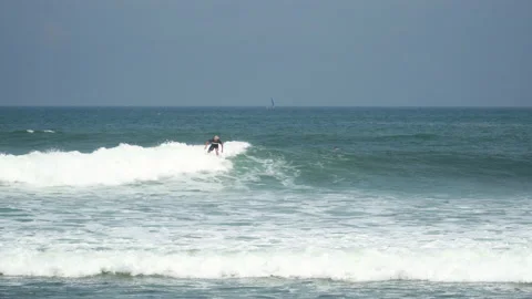 Surfer riding and turning blue ocean wav... | Stock Video | Pond5