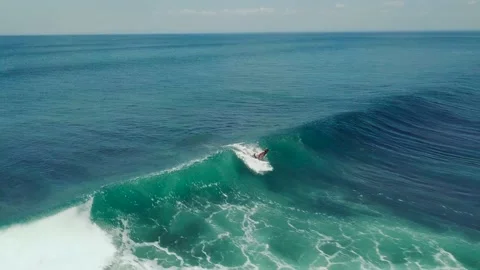 Surfer riding and turning with spray on ... | Stock Video | Pond5