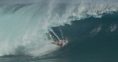 Surfer surfing barrel tube wave at Banza... | Stock Video | Pond5