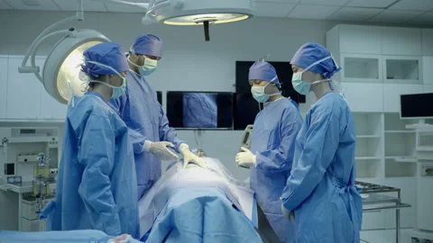 Surgeon doing surgery inside operating r... | Stock Video | Pond5