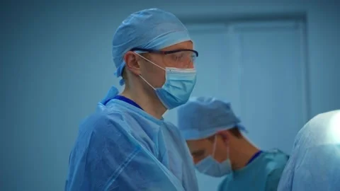 Surgeon in the operating room. Side view... | Stock Video | Pond5