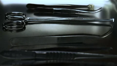 A surgeon picking up surgical tools, 4K | Stock Video | Pond5