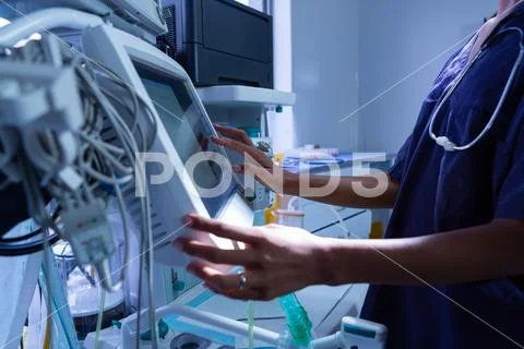 Surgeon using medical equipment in operating room of the hospital Stock ...