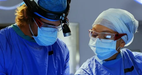 Surgeons performing operation 4k | Stock Video | Pond5