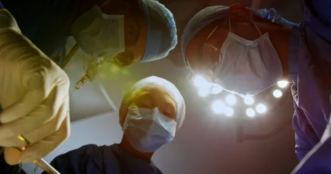 Surgeons performing operation 4k | Stock Video | Pond5