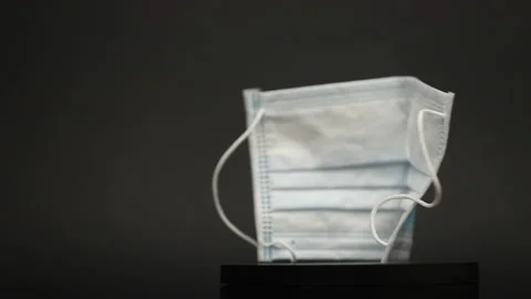 surgical mask on a rotating plate on a b... | Stock Video | Pond5