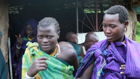 Suri tribe people coming out from the ch... | Stock Video | Pond5