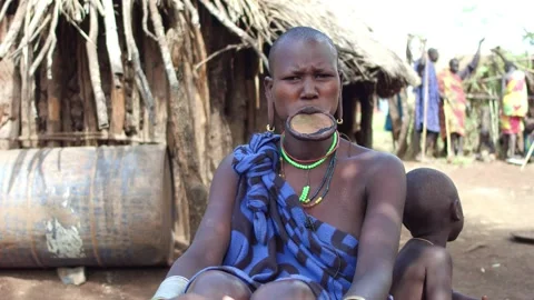 Suri tribe woman with a lip plate and he... | Stock Video | Pond5