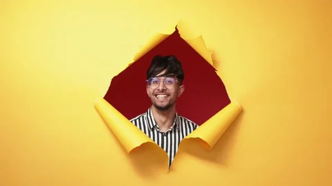 surprise hi hello man peeking out from p... | Stock Video | Pond5