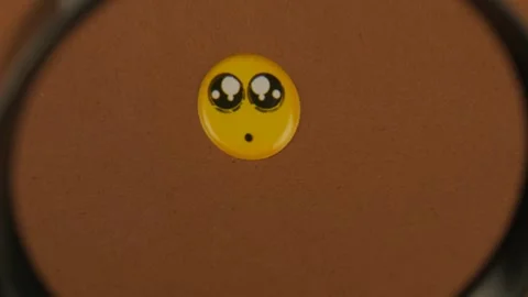 Surprised Smiley Face Under Magnifying G... | Stock Video | Pond5