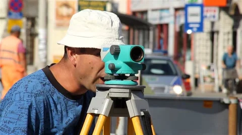 Surveyor on construction site measuring ... | Stock Video | Pond5