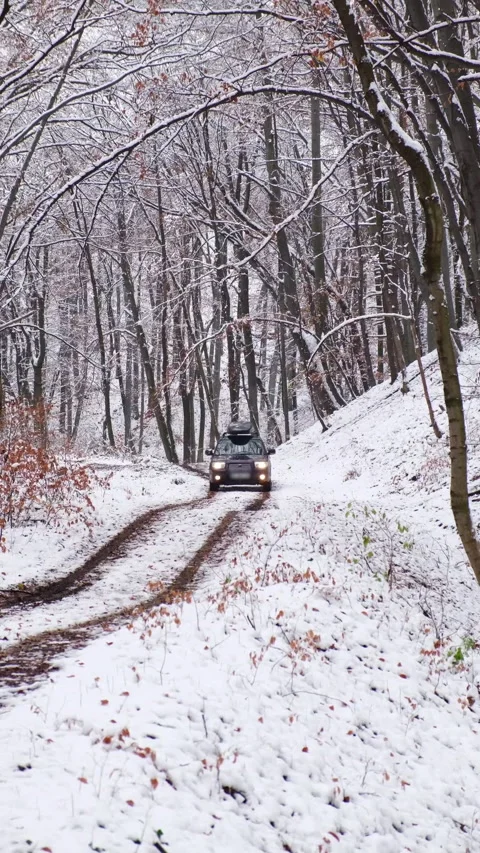 suv car on trail road in snowed winter f... | Stock Video | Pond5