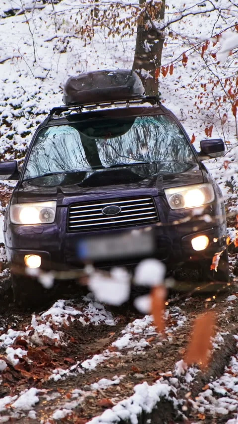 suv car on trail road in snowed winter f... | Stock Video | Pond5