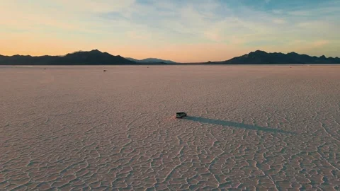 SUV races across barren Bonneville Salt ... | Stock Video | Pond5