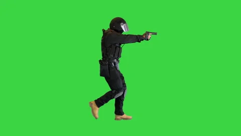 Swat agent running and aiming with a gun... | Stock Video | Pond5
