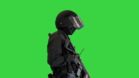 Swat operator with assault rifle walking... | Stock Video | Pond5