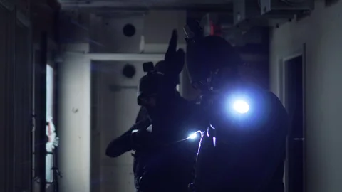 SWAT team walking on corridor during tac... | Stock Video | Pond5