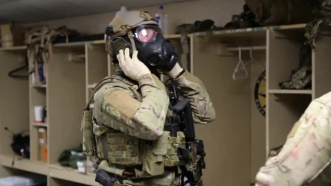 SWAT Trainee Adjusts Gas Mask for Traini... | Stock Video | Pond5