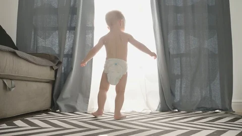 Sweet baby at home in diapers. | Stock Video | Pond5