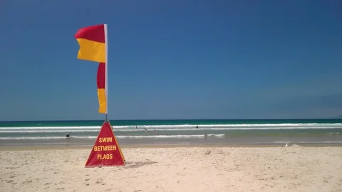 Swim between the flags at the beach, New... | Stock Video | Pond5