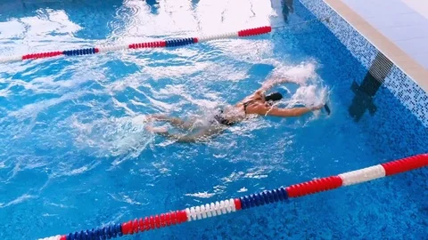 Swimmer finishing swimming race in a swi... | Stock Video | Pond5