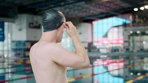 Swimmer looking at a pool focusing on th... | Stock Video | Pond5