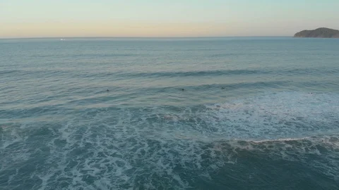 Swimmers floating on the mild waves of b... | Stock Video | Pond5