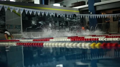swimmers jumping into the diving pool in... | Stock Video | Pond5