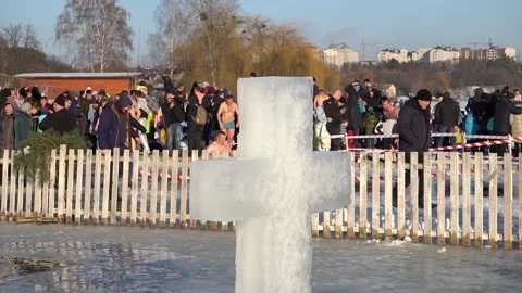 Swimming in the ice hole, water baptism,... | Stock Video | Pond5