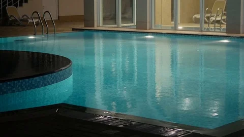 Swimming pool. Evening. Easy movement of... | Stock Video | Pond5
