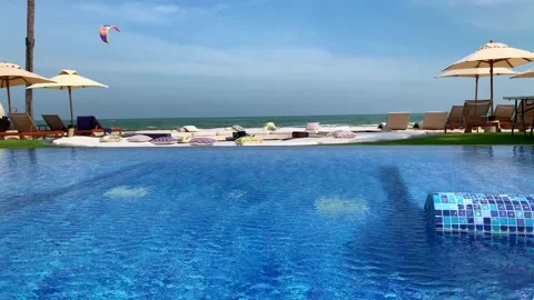 Swimming pool with the ocean beach and a... | Stock Video | Pond5