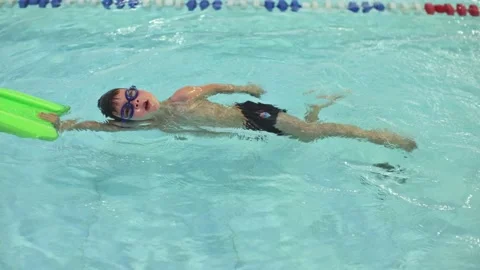 swimming pool training lesson for kids l... | Stock Video | Pond5