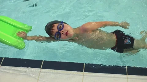 swimming pool training lesson for kids l... | Stock Video | Pond5