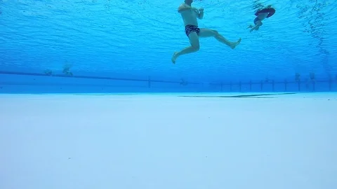 Swimming in the pool. Underwater shoot o... | Stock Video | Pond5
