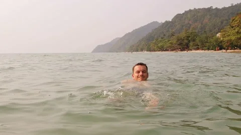 Swimming in the sea. tropical beach vaca... | Stock Video | Pond5