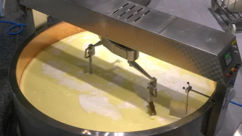 Swiss cheese factory with milk tank stir... | Stock Video | Pond5