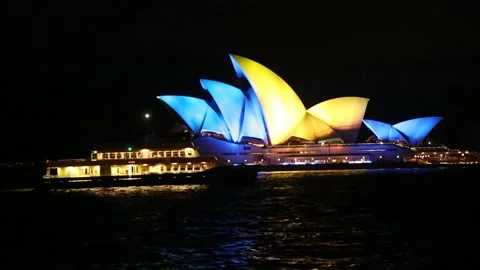 Sydney Opera House lights up with colour... | Stock Video | Pond5
