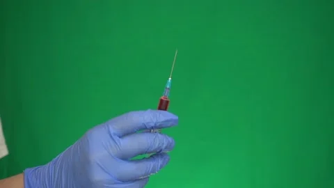 syringe with medicine on a green screen | Stock Video | Pond5