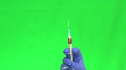 syringe with medicine on a green screen | Stock Video | Pond5