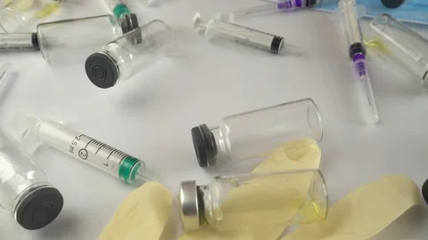 Syringes and falling ampoules. Slow moti... | Stock Video | Pond5