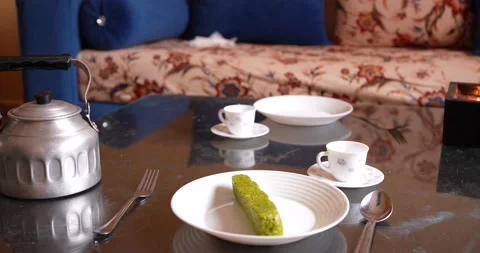 Table ready for dinner with a teapot and... | Stock Video | Pond5