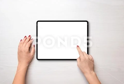 Tablet on desk in horizontal position and isolated screen for mockup ...