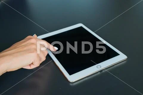 Tablet device, black screen on gray background ~ Premium Photo #93715044