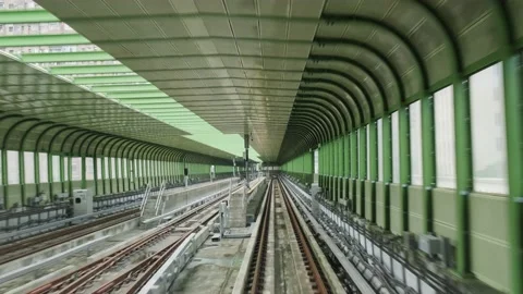 Taichung MRT train climbs the ramp and e... | Stock Video | Pond5