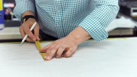 Tailor hands mark drawing on craft paper... | Stock Video | Pond5