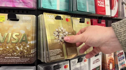 Taking mastercard gift card from shelf a... | Stock Video | Pond5